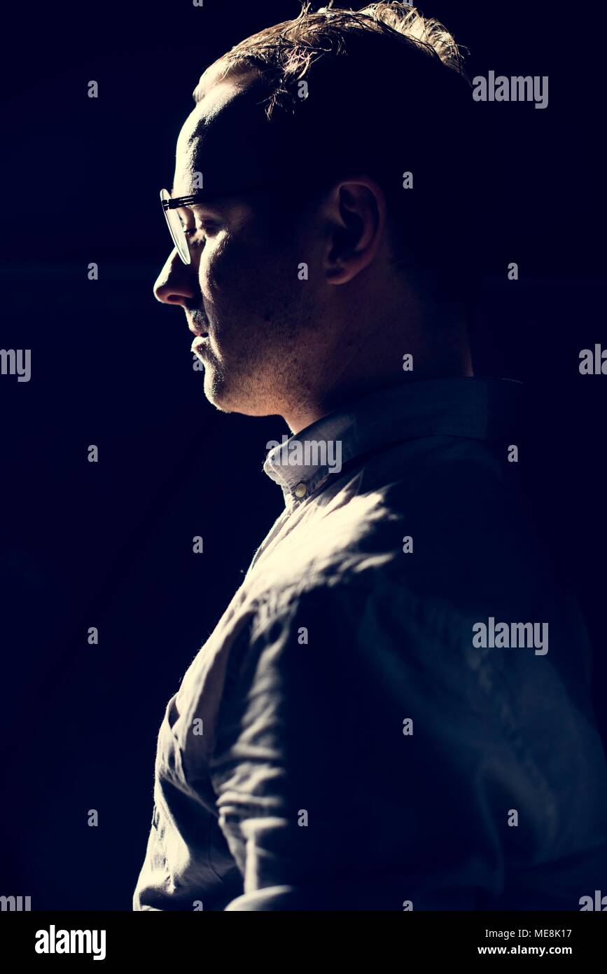 Portrait man side view Stock Photo - Alamy
