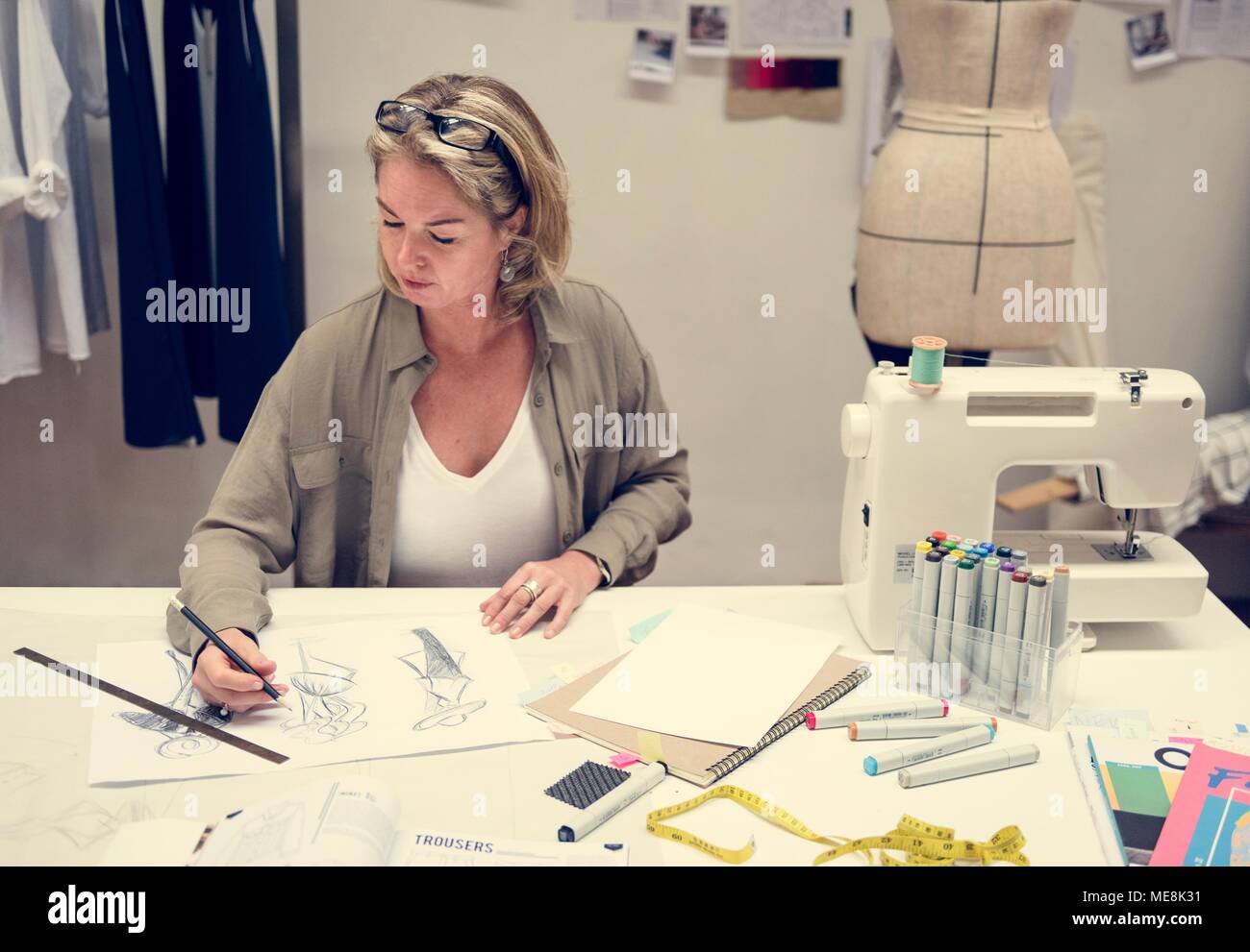 Woman working on projects Stock Photo - Alamy