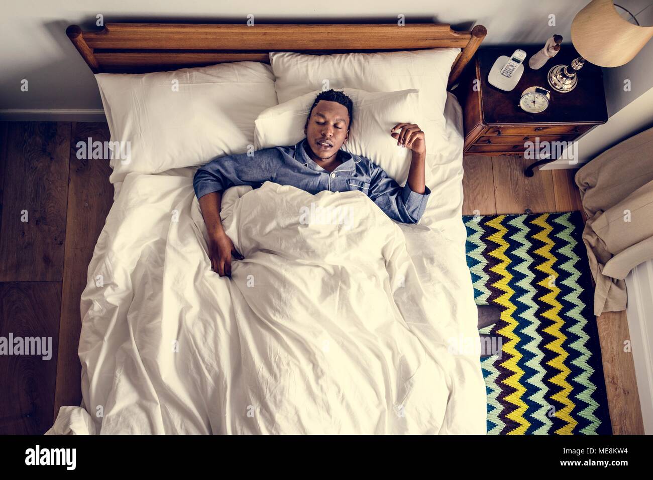 Black man sleeping hi-res stock photography and images - Alamy
