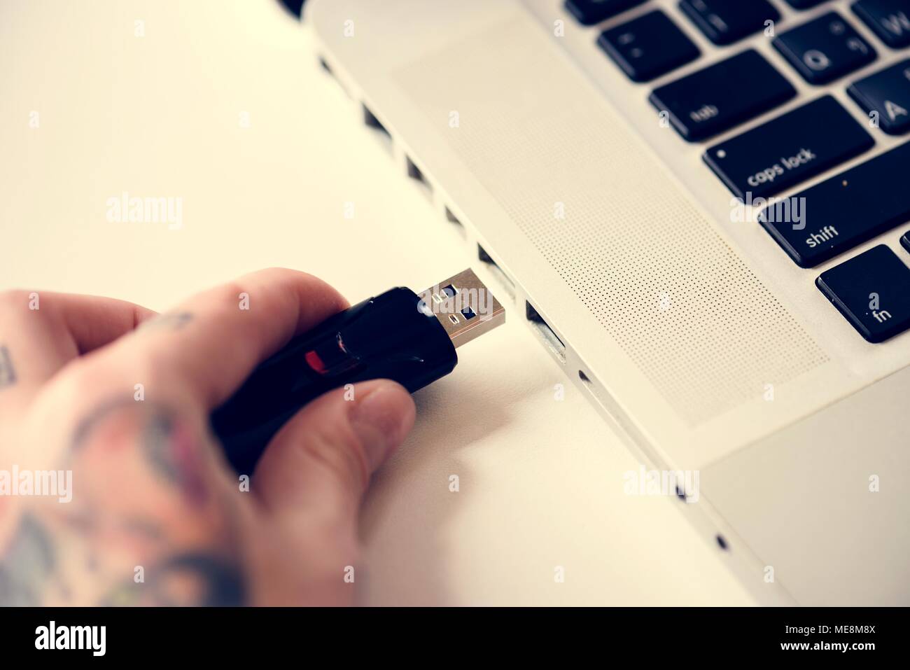 Hand holding Universal Serial Bus portable data backup Stock Photo - Alamy