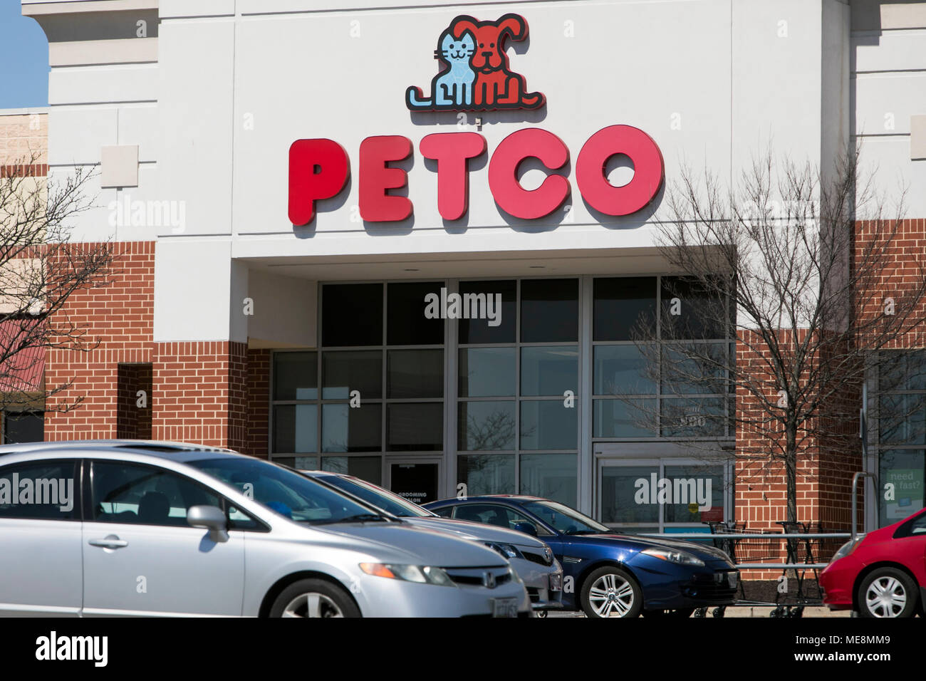 A logo sign outside of a Petco retail store location in Columbia ...
