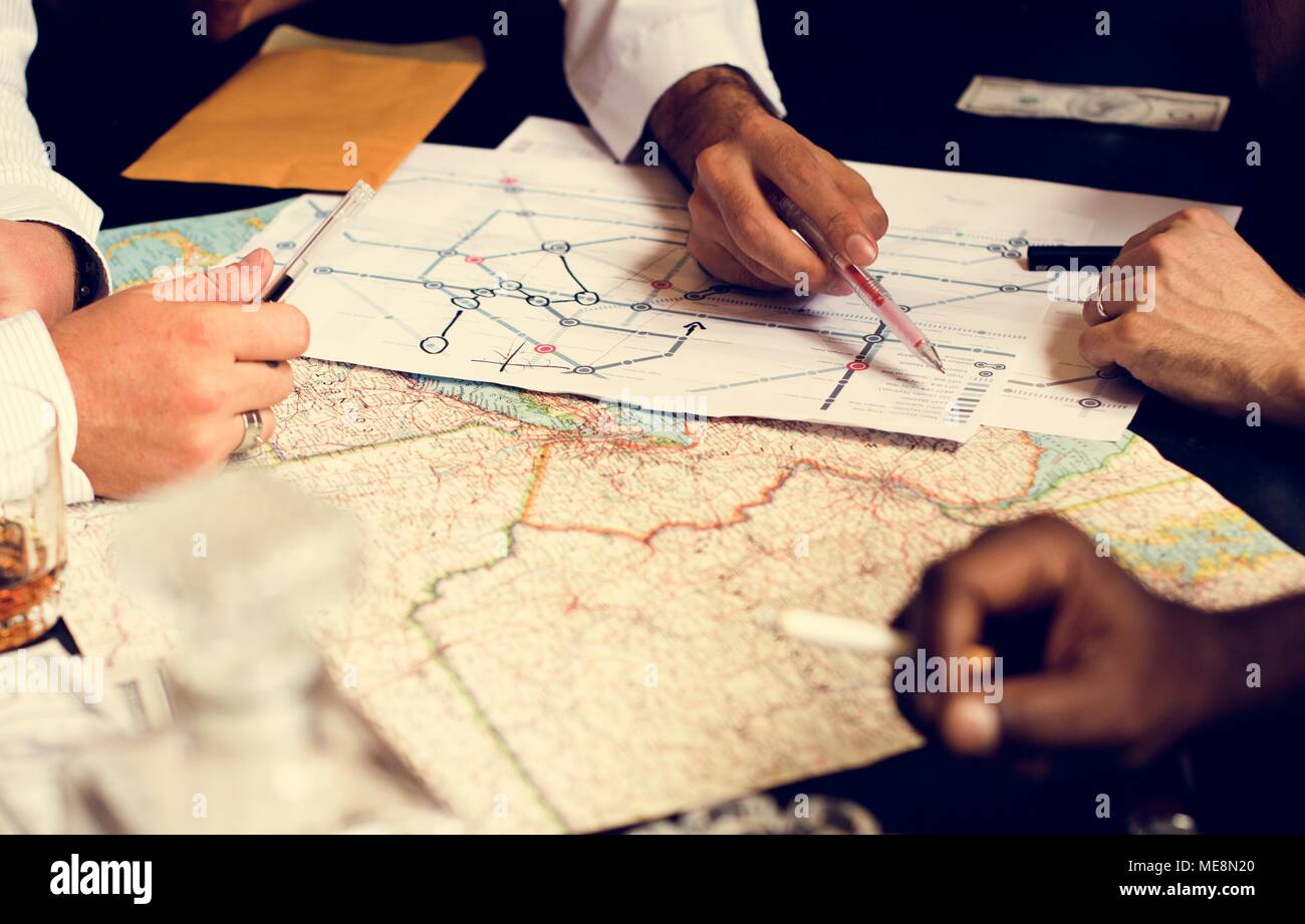 Group of people planning with the map Stock Photo - Alamy