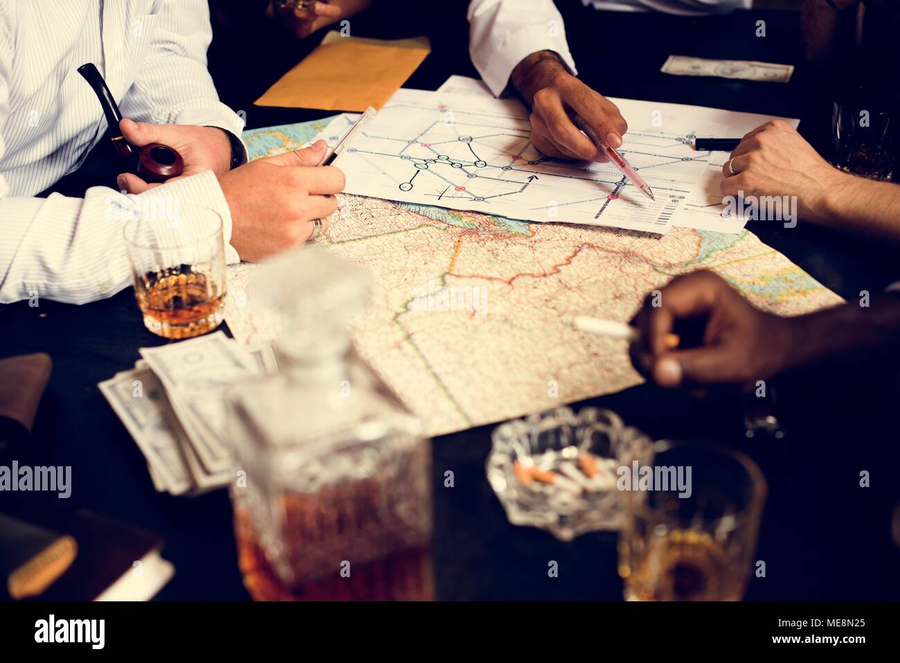Group of people planning with the map Stock Photo - Alamy