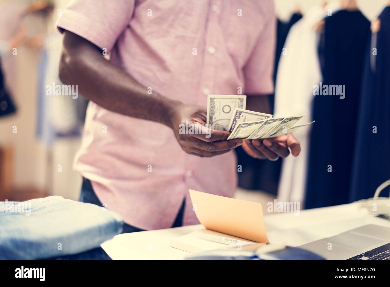 Colleague counting money after work Stock Photo - Alamy