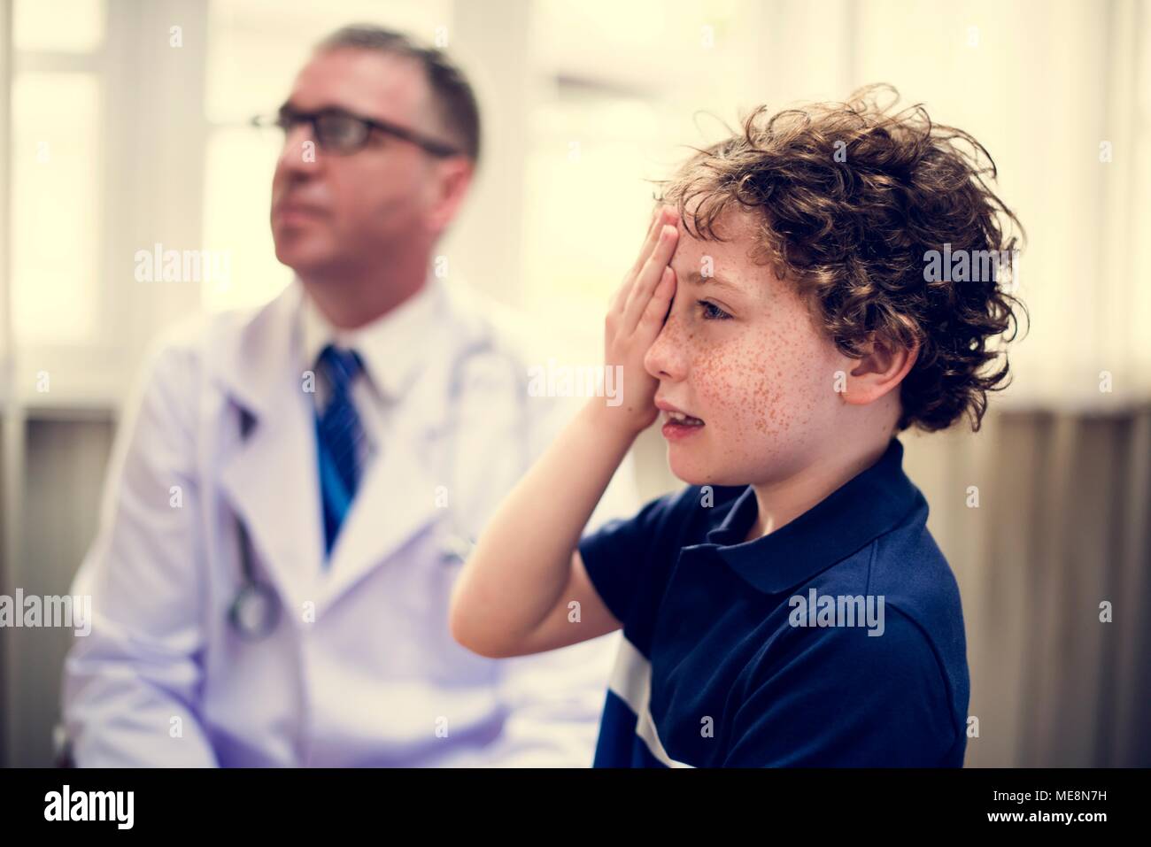 Little boy getting his eyes checked Stock Photo - Alamy