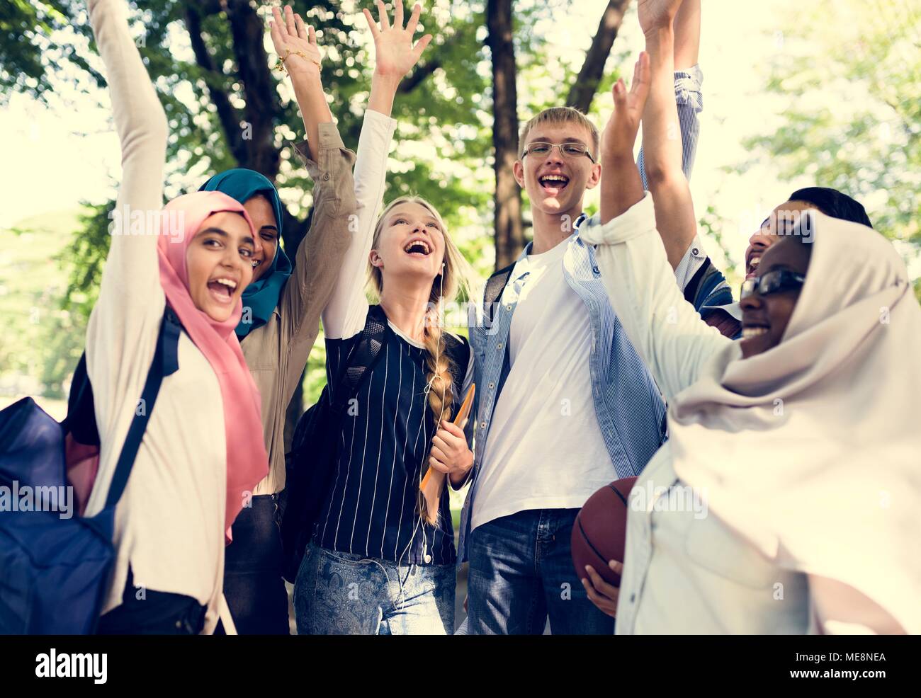 Diverse teenagers teamwork together Stock Photo - Alamy