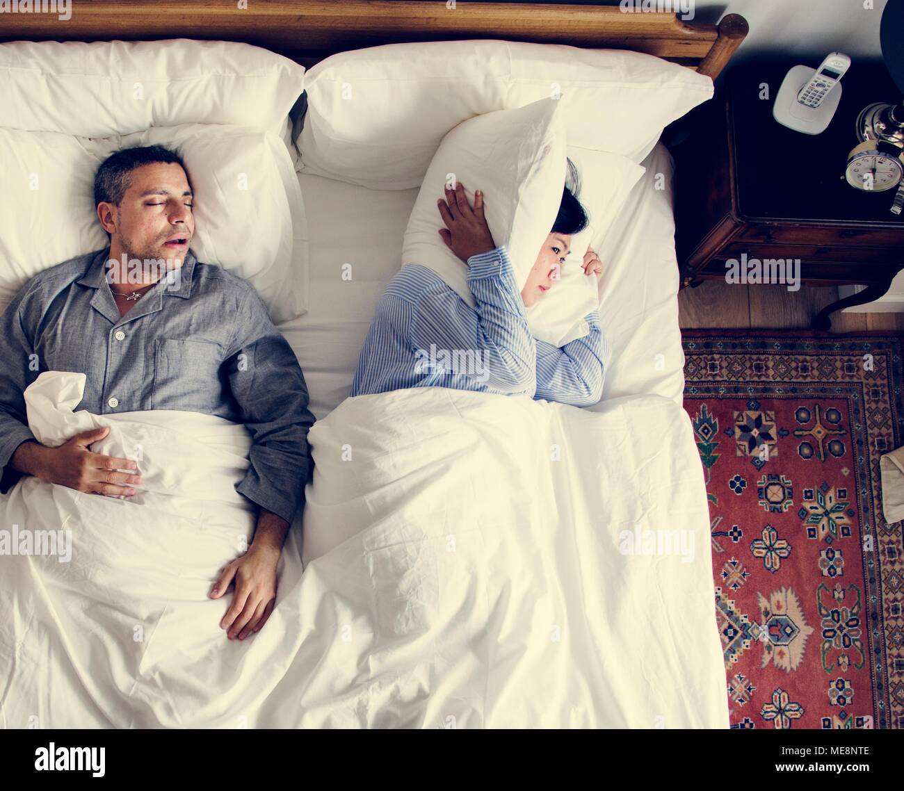 Interracial couple sleeping hi-res stock photography and images - Alamy
