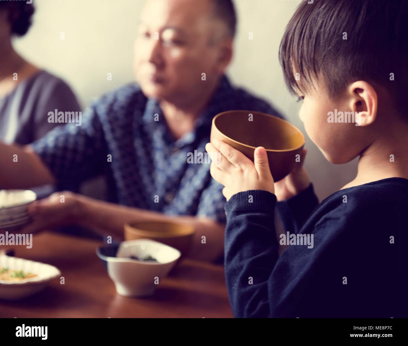 Asian boy eating soup hi-res stock photography and images - Alamy