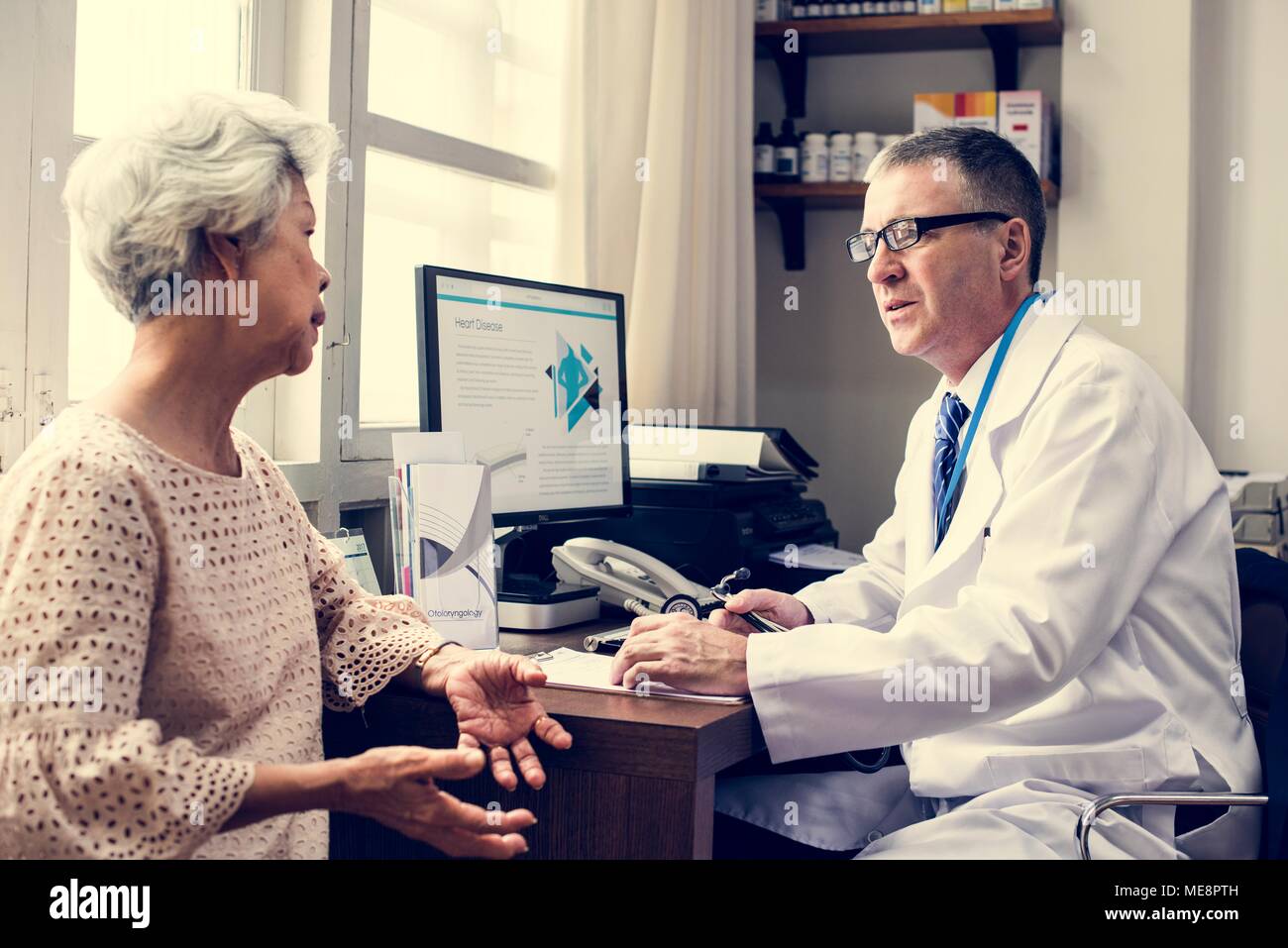 Doctor with a patient Stock Photo - Alamy