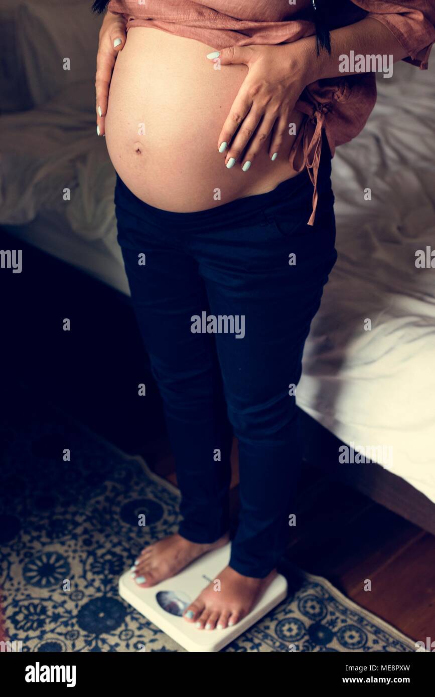 A pregnant woman scale Stock Photo - Alamy