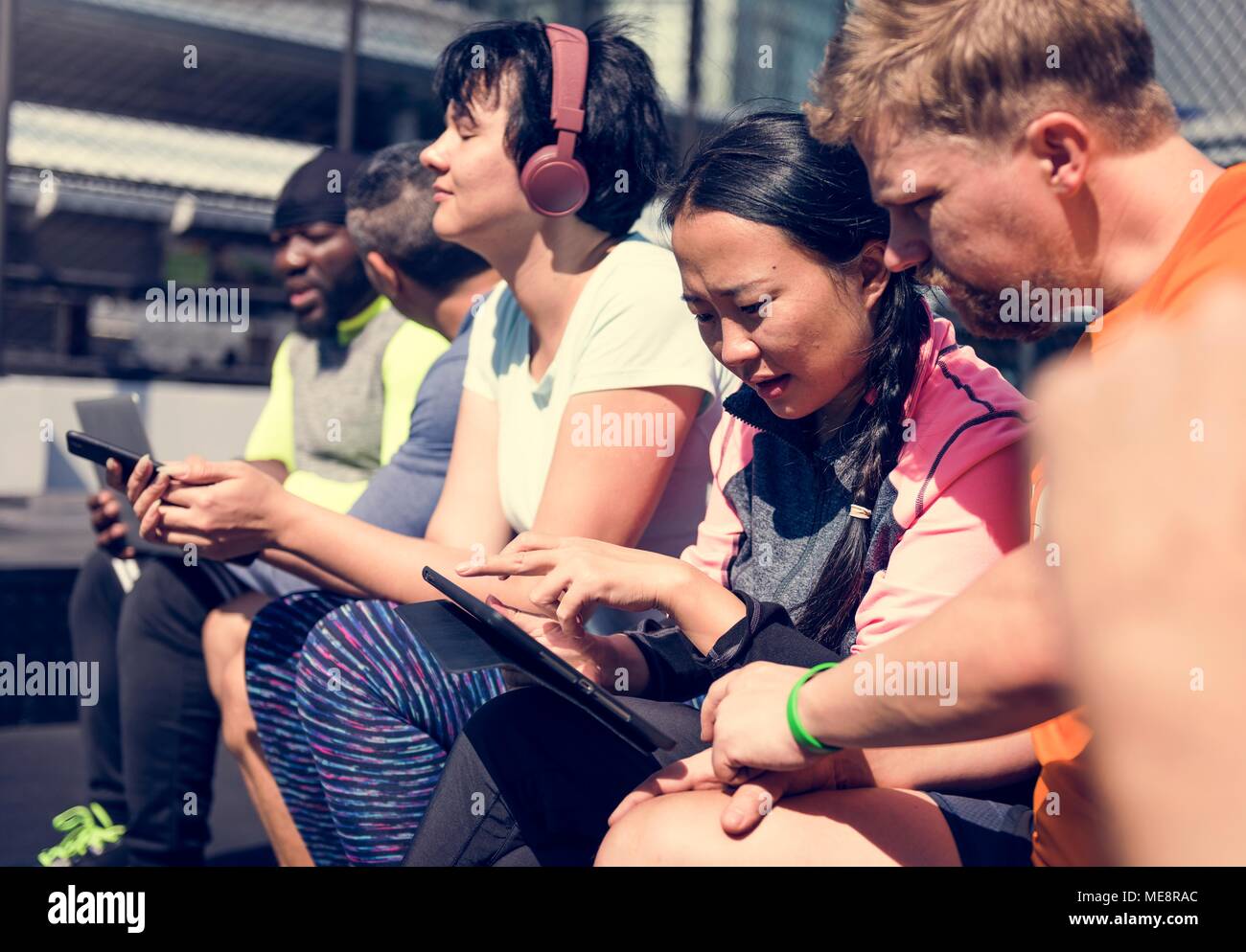 Group of diverse people using digital devices Stock Photo - Alamy