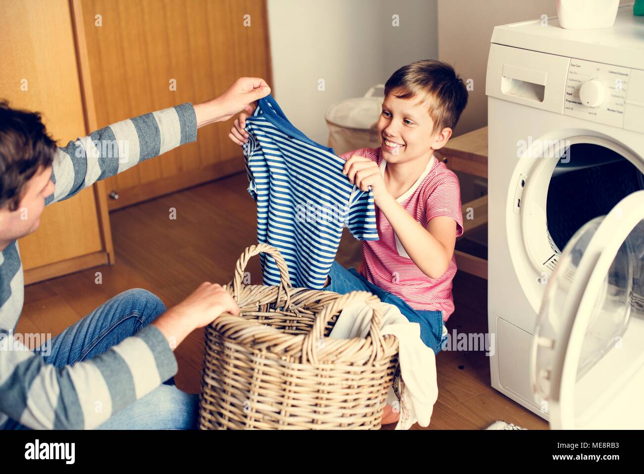 Kid helping house chores Stock Photo - Alamy