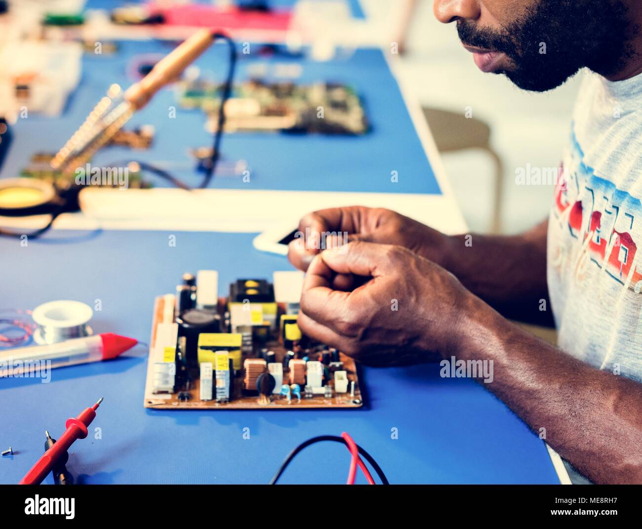 Electrical technician working on electronic board Stock Photo - Alamy
