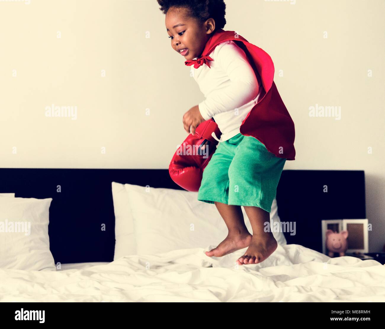 Black kid jumping hi-res stock photography and images - Alamy