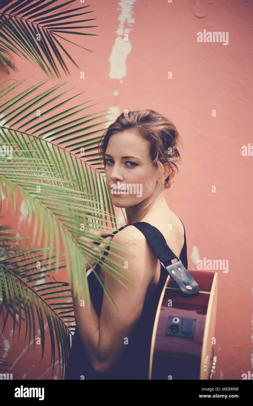 Beautiful guitarist woman with guitar classic Stock Photo - Alamy