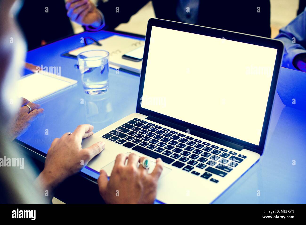 Hands on laptop working in a technology meeting Stock Photo - Alamy