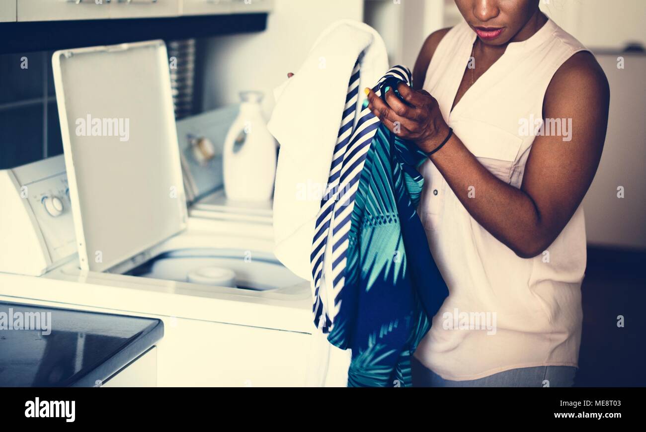 African woman doing laundry hi-res stock photography and images - Alamy