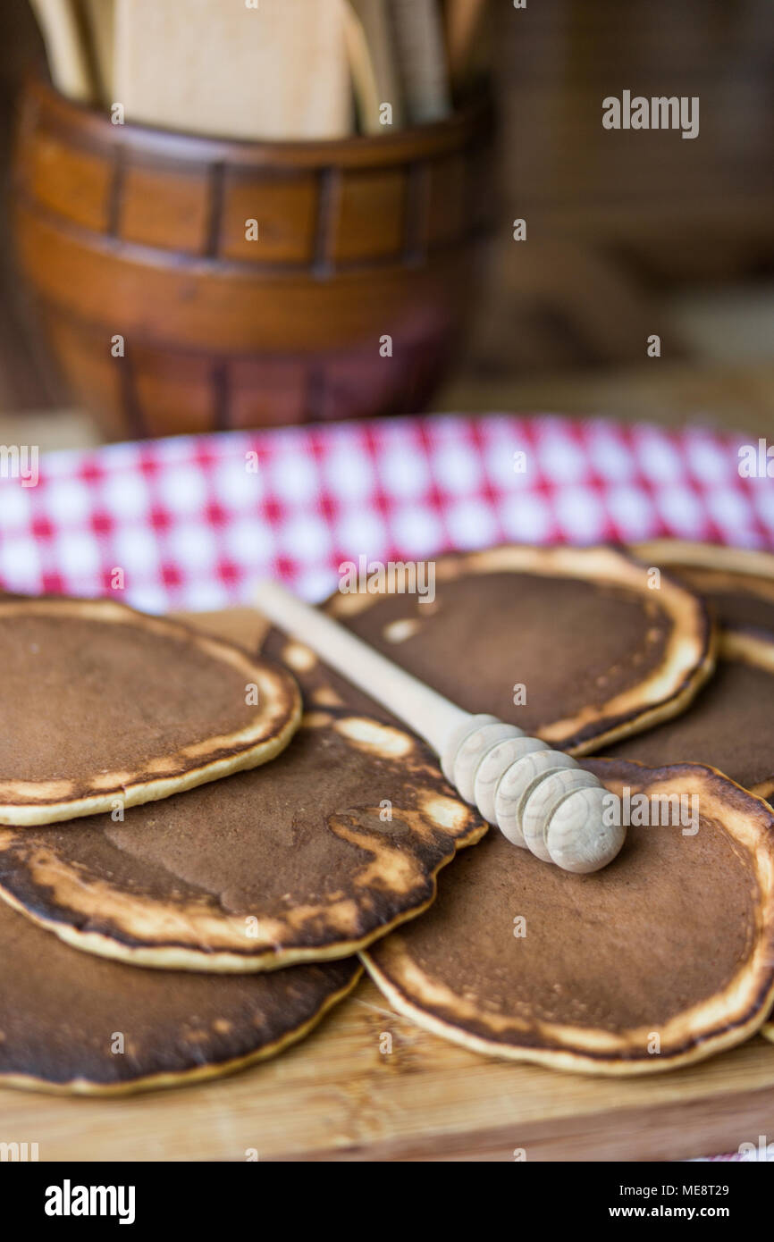 Stack of plain Pancakes on wooden surface Stock Photo - Alamy