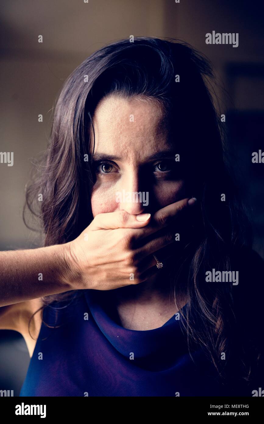 Mouth covered with hand hi-res stock photography and images - Alamy