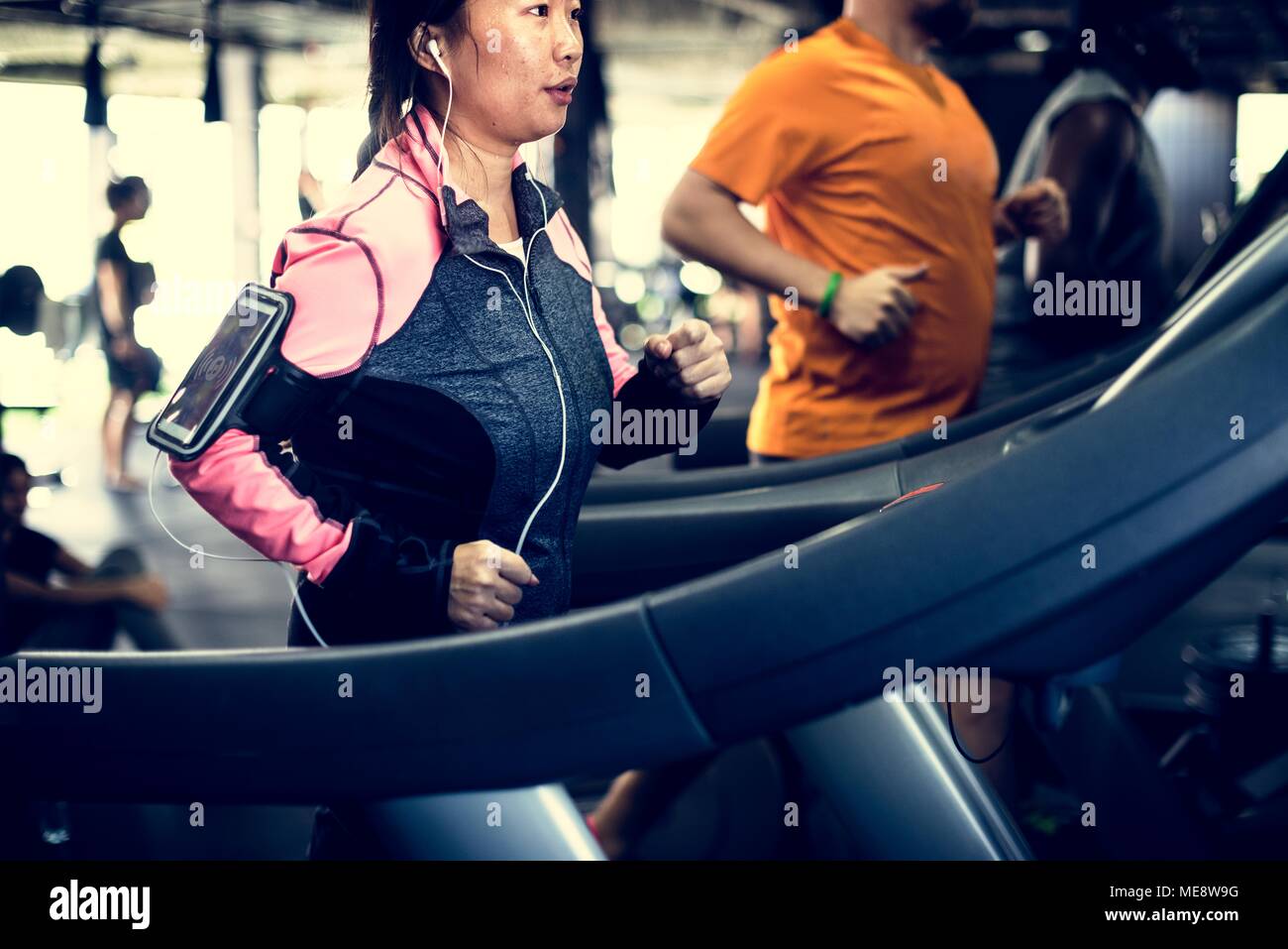 People exercising at fitness gym Stock Photo - Alamy