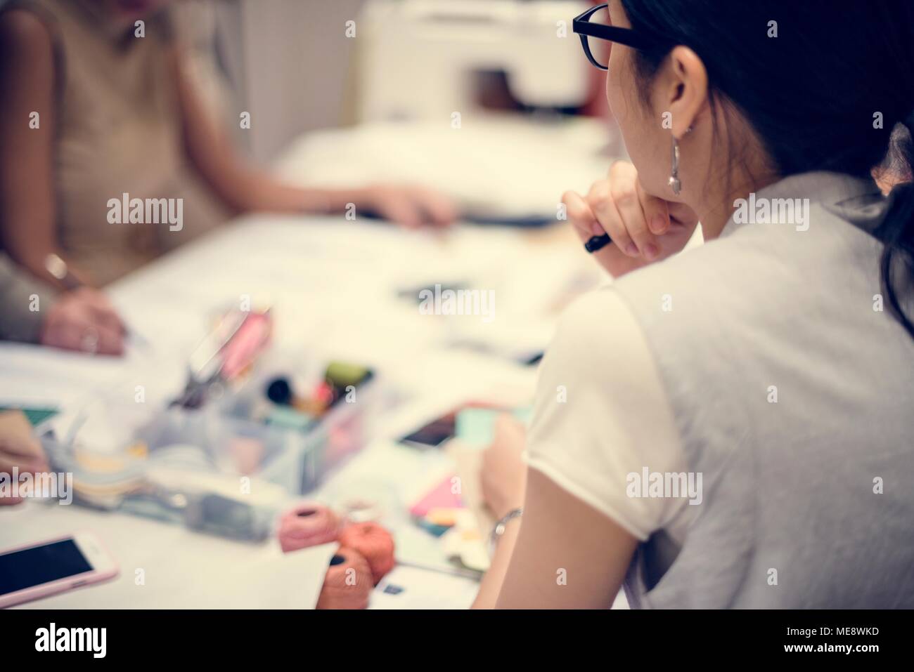 Woman working on projects Stock Photo - Alamy