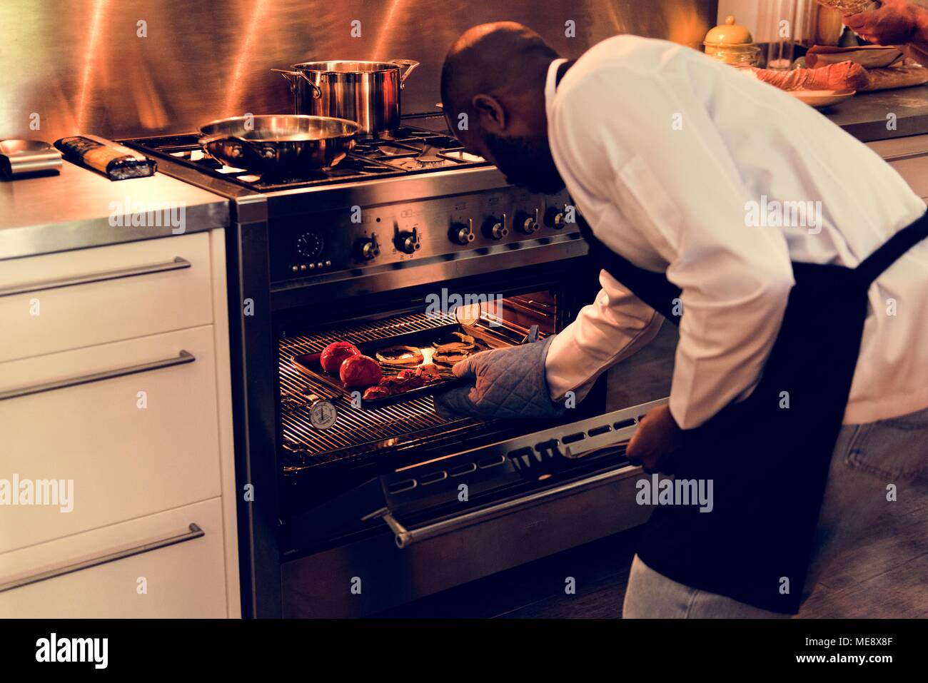 People is cooking in the kitchen Stock Photo - Alamy