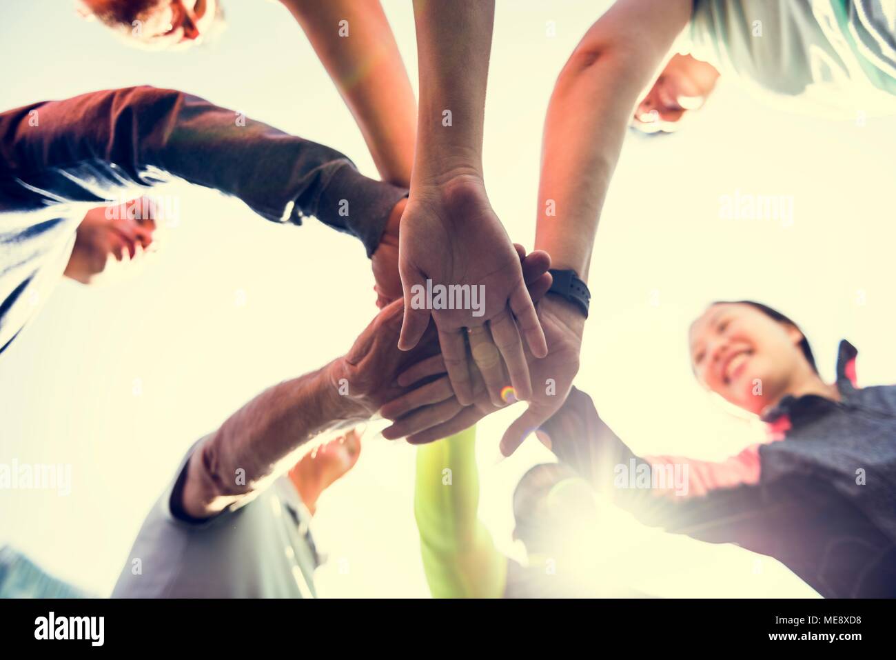 Diverse people joined hands together Stock Photo - Alamy