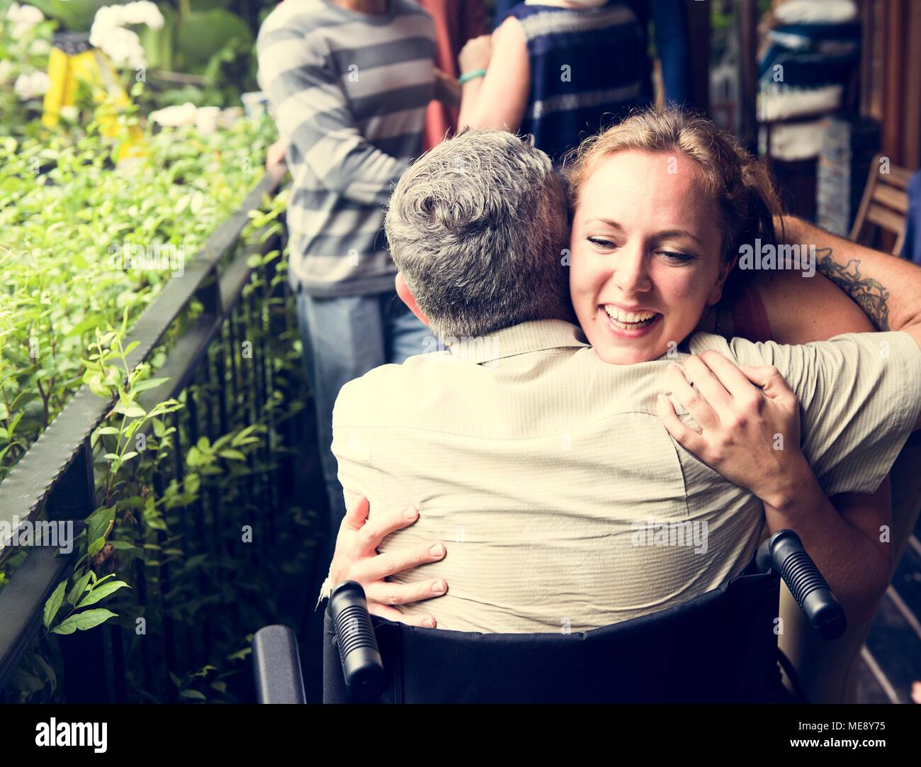 Friends hugging each other Stock Photo - Alamy