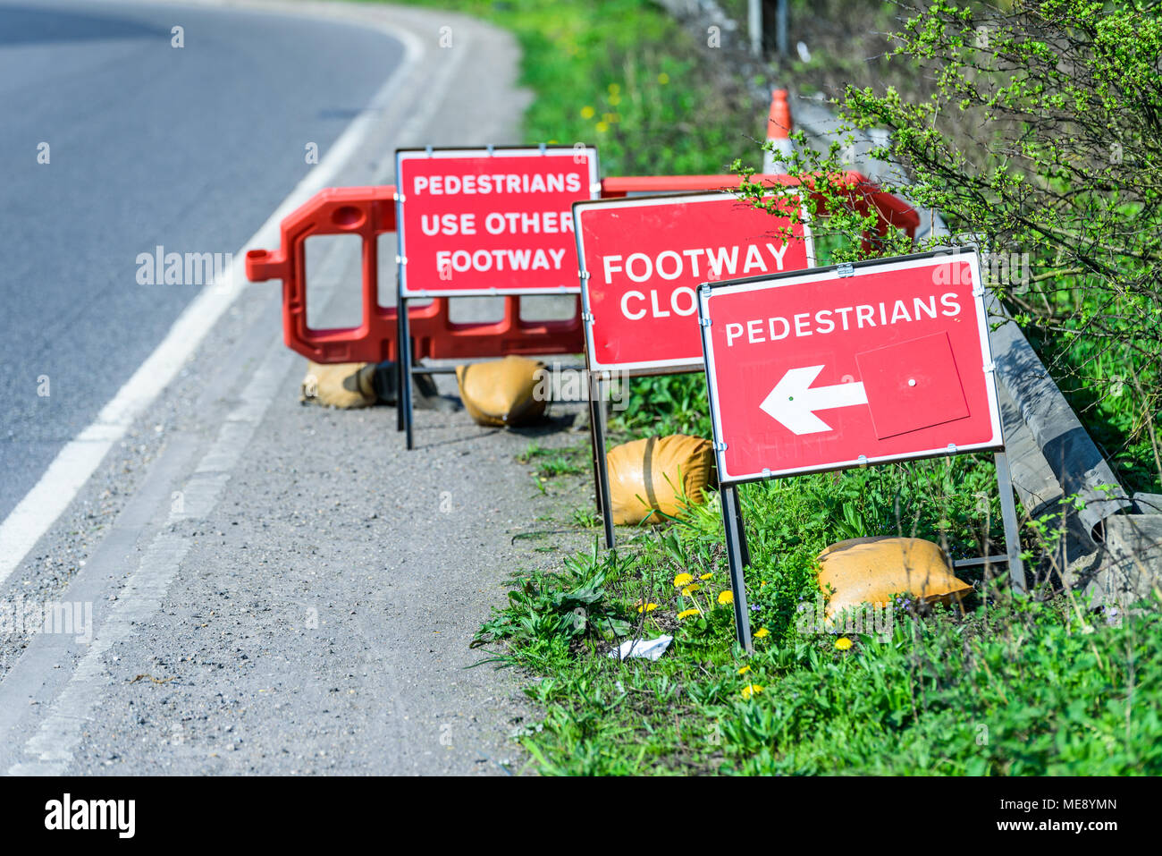 Pedestrians Footpath Closed Roadworks signs UK motorway Stock Photo - Alamy