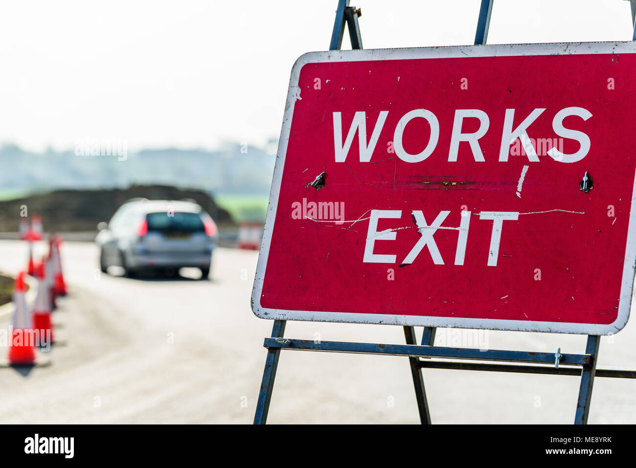 Works Exit Roadworks sign on UK motorway Stock Photo - Alamy