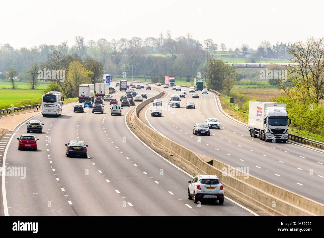 Sunny day view of UK motorway traffic Stock Photo - Alamy