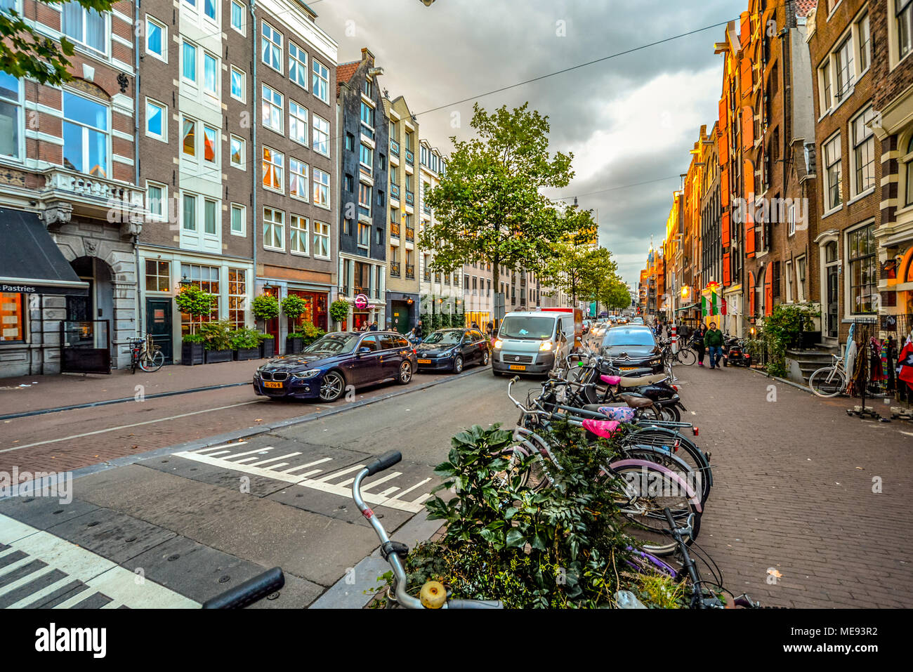 A typical Amsterdam street off the main canal area with bicycles and ...