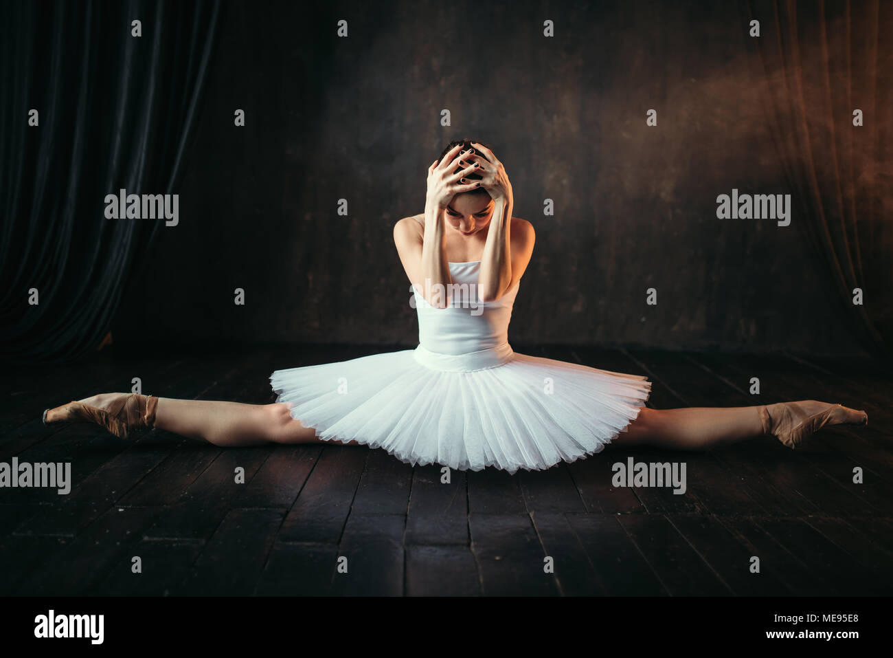 Body flexibility of ballet performer, stretching exercise. Ballerina in ...