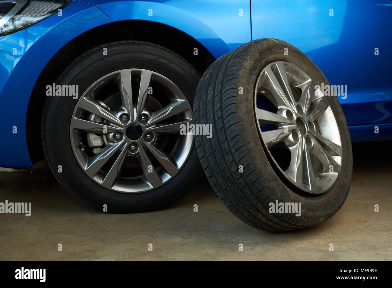 Replaced damaged car wheel. Damaged wheel on hole in road Stock Photo ...