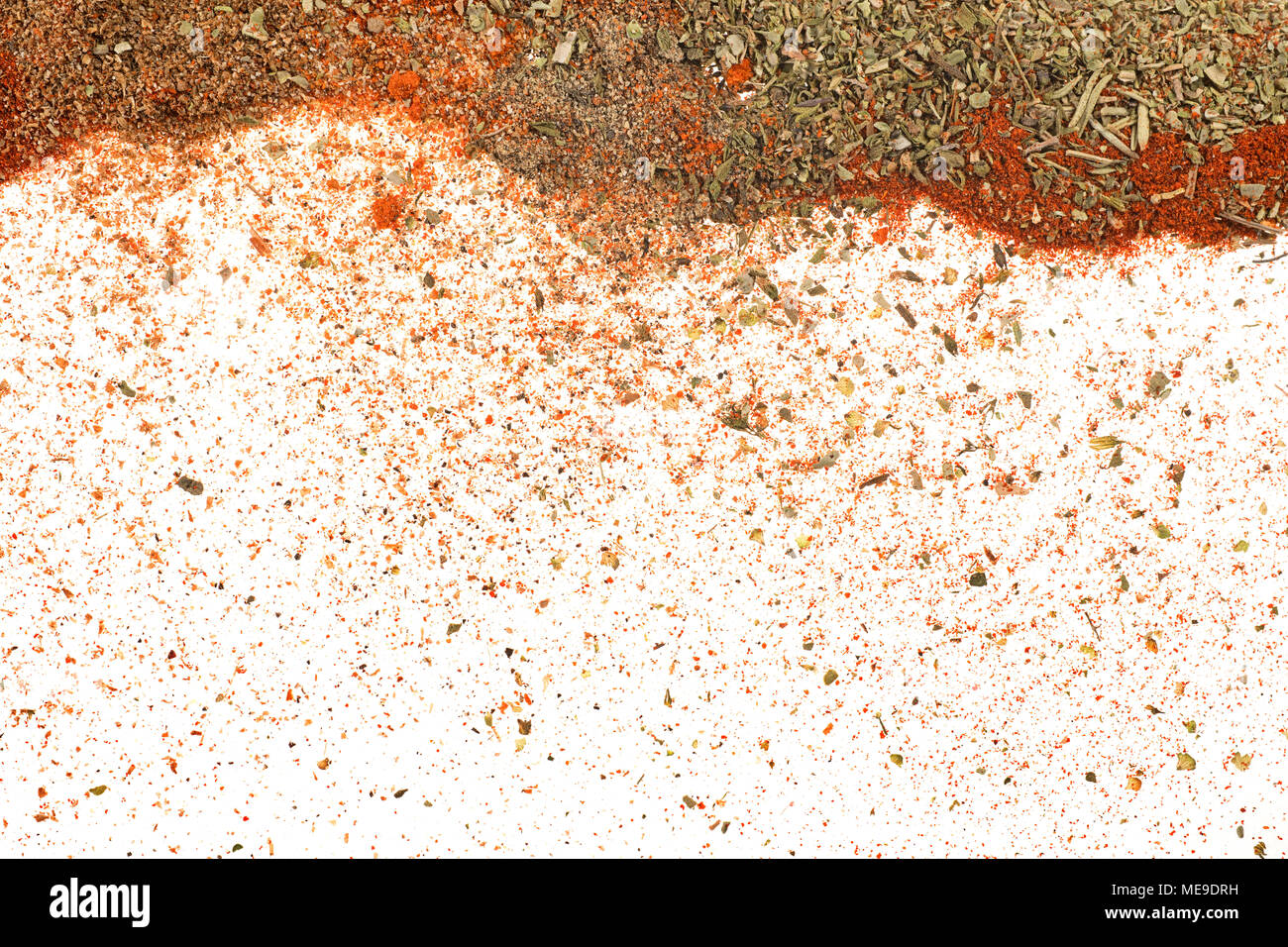 Different spices and herbs scattered on white background top view ...