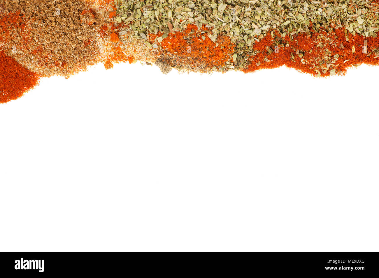 Different spices and herbs laying on white background as border ...