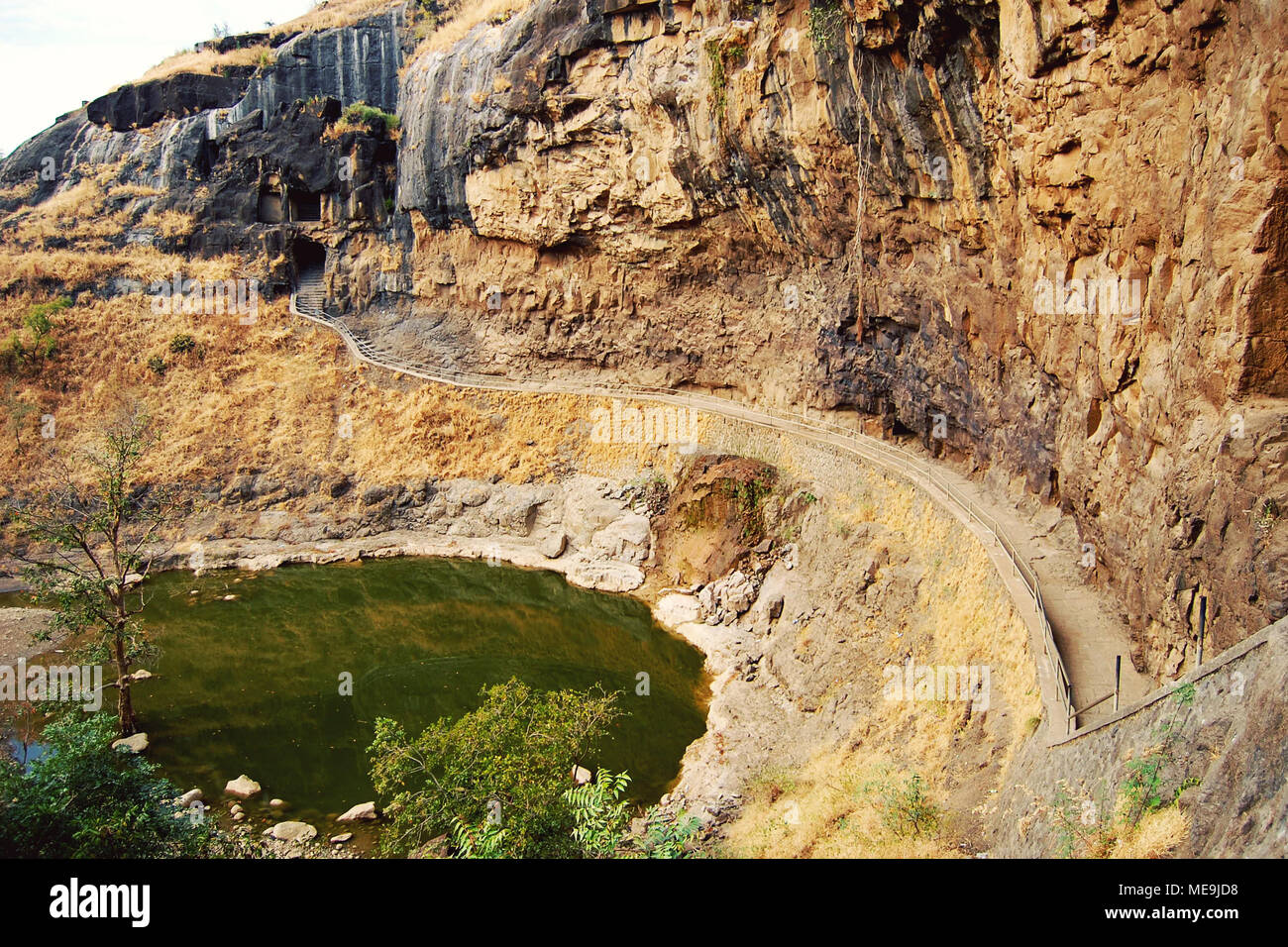 Way into the one of Ellora Caves. Aged photo. Complexes of the rock-cut ...