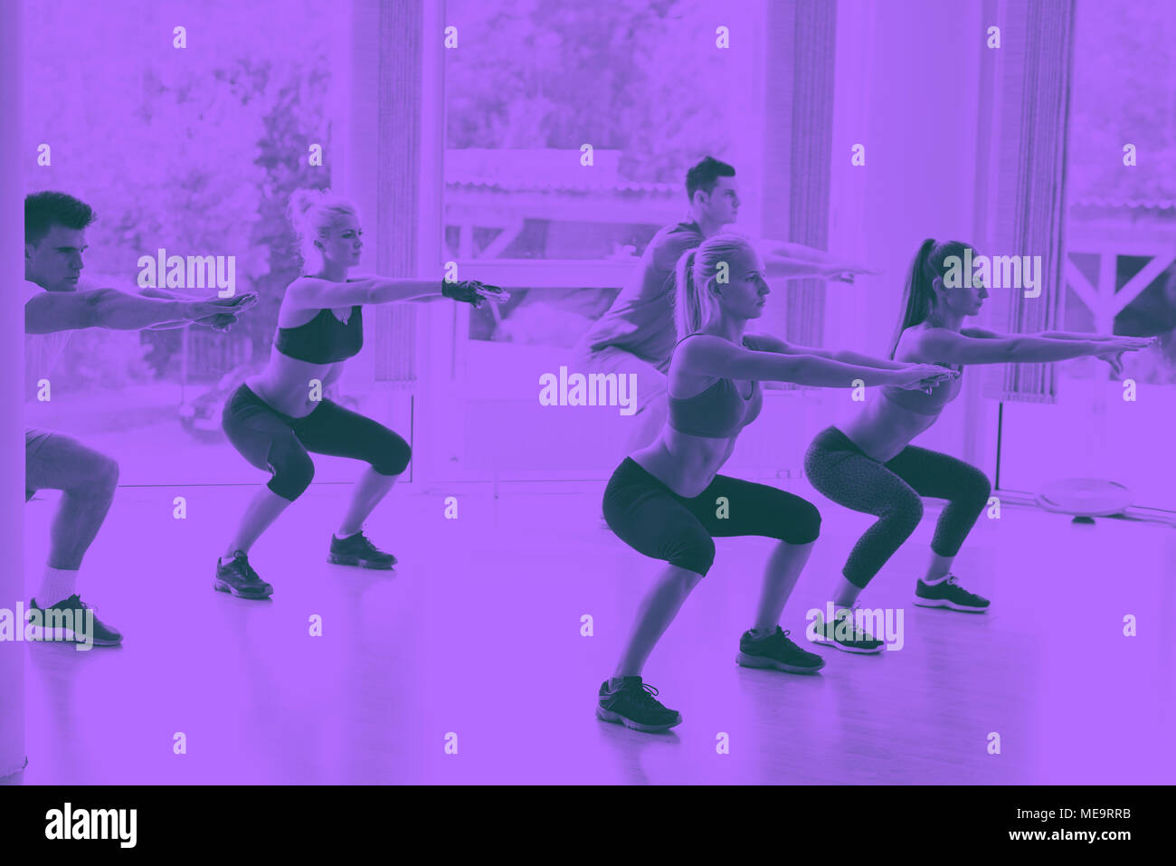 Group of people exercising at the gym and stretching duo tone Stock ...