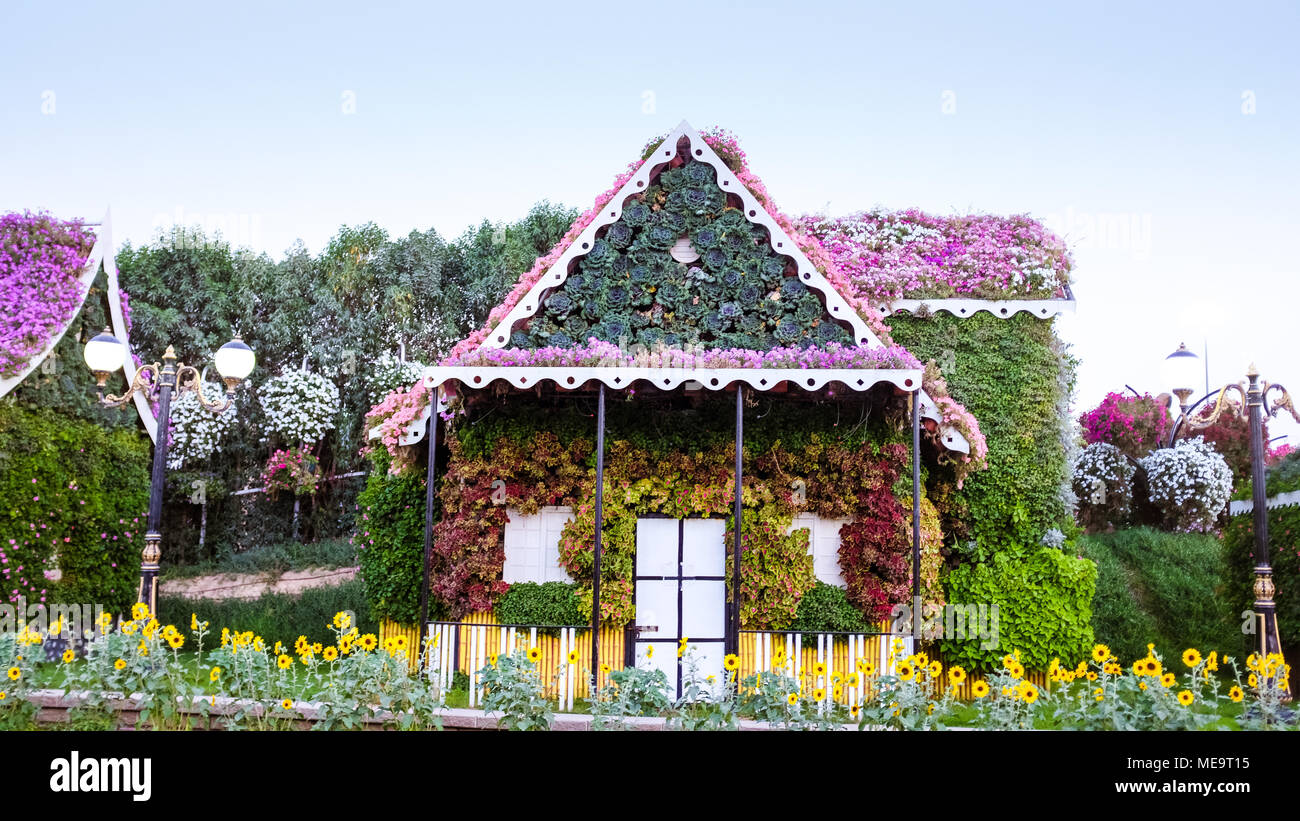 Beautiful houses covered with flowers Stock Photo - Alamy