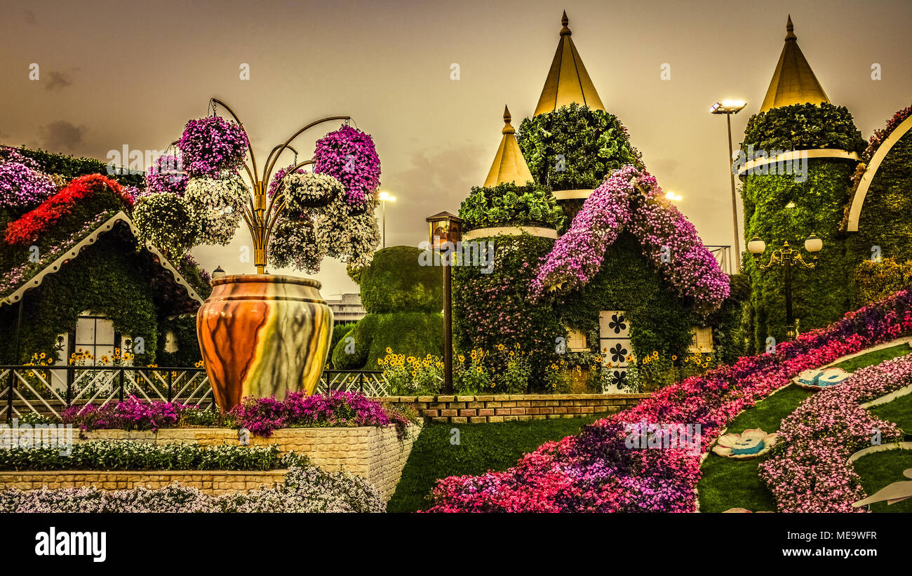 Romantic houses covered with colorful flowers Stock Photo - Alamy