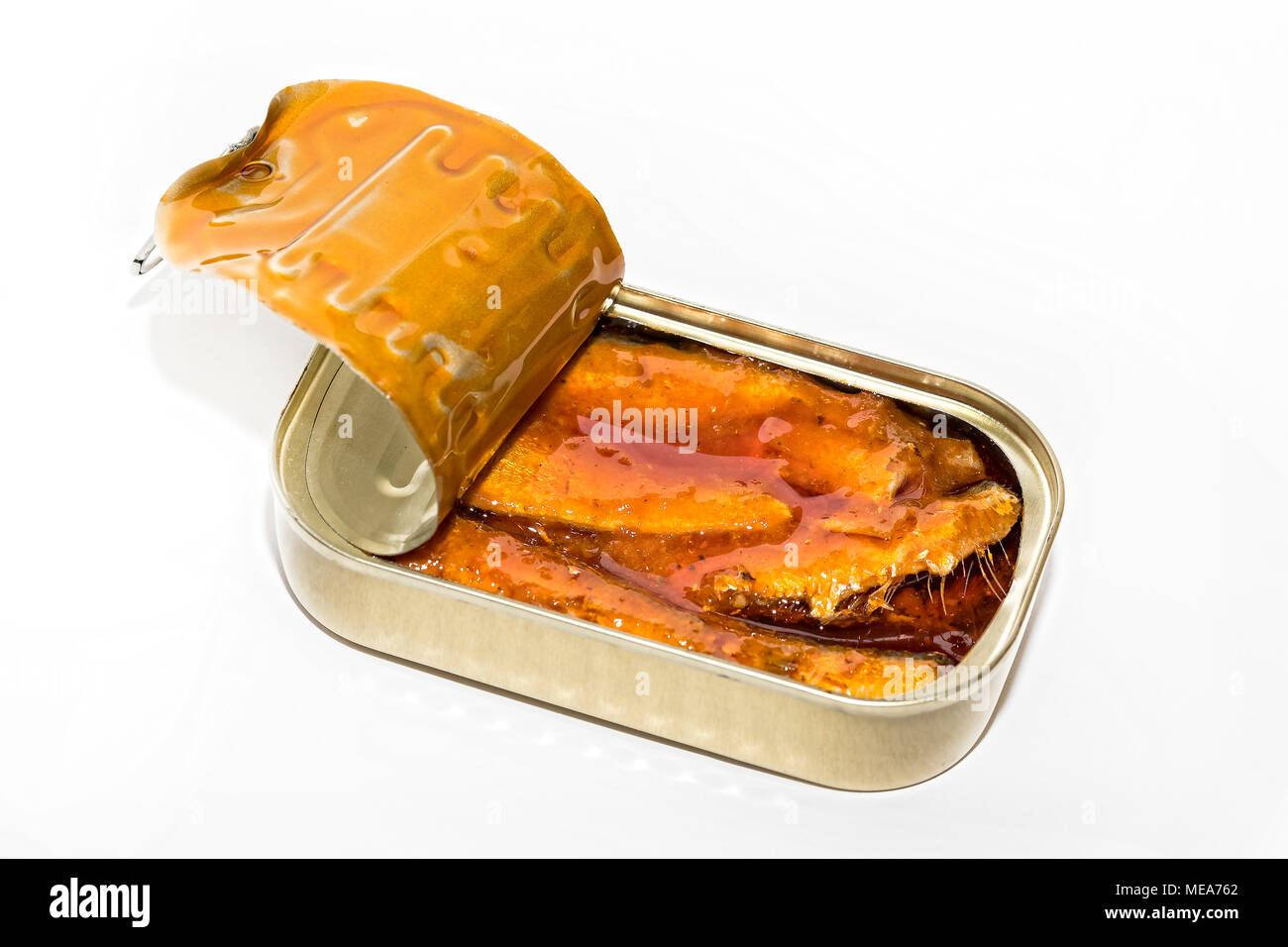 Open can with canned seafood close-up on a white background Stock Photo ...