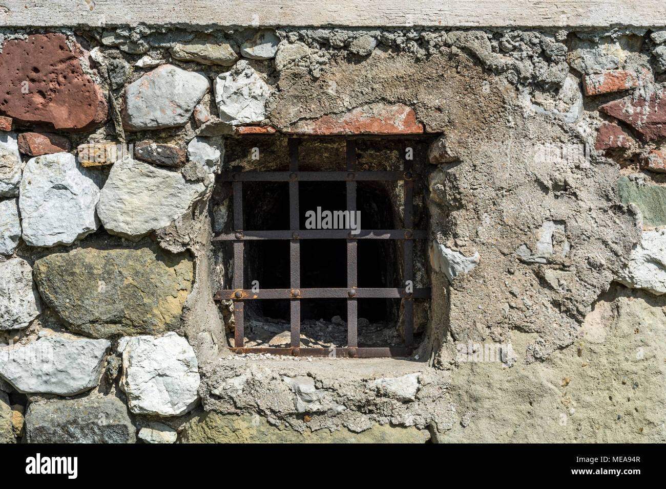 Old prison window in castle cell wall with metal bars, dark age Stock ...