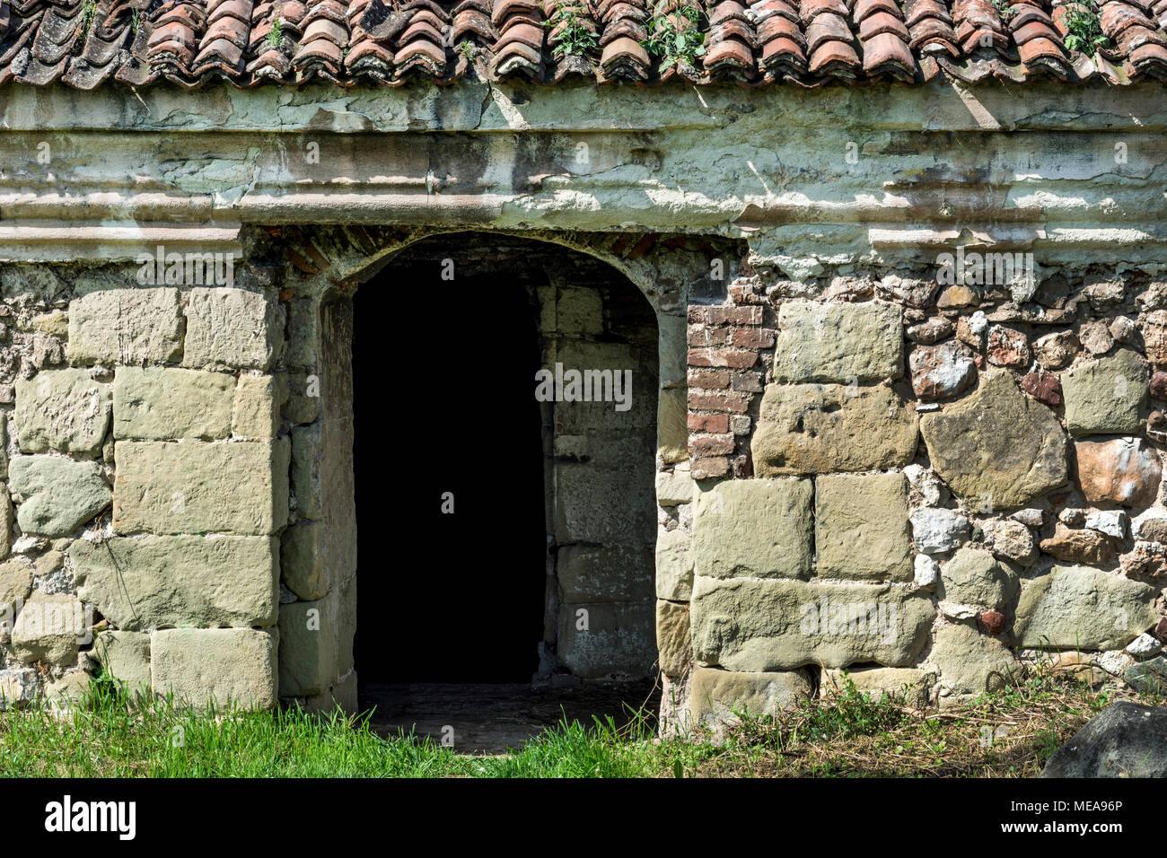 Very old entrance door and stone wall on antique building Stock Photo ...