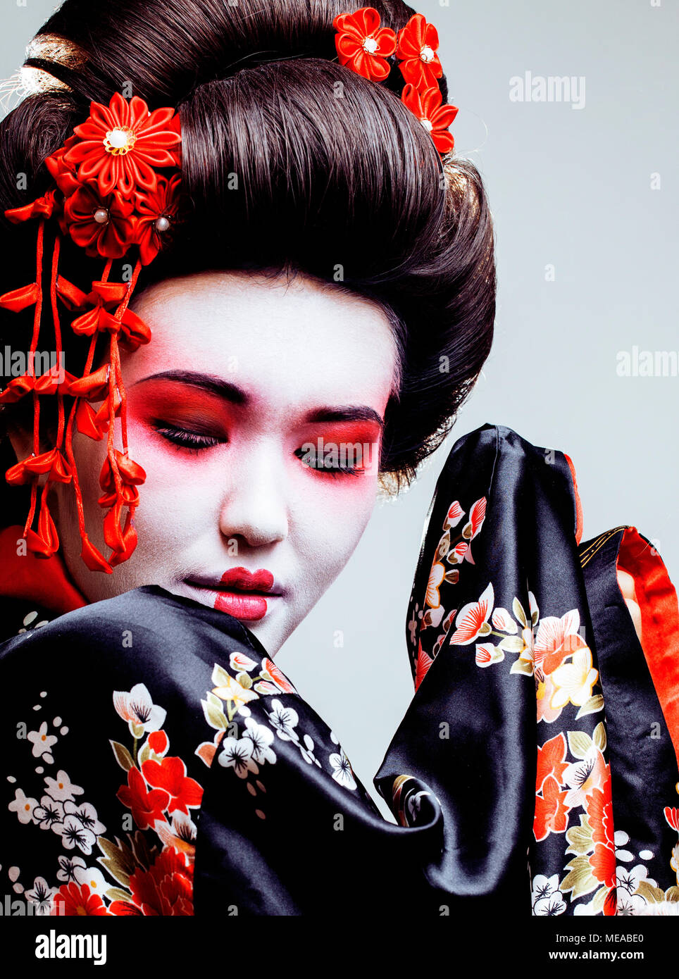 young pretty geisha in black kimono among sakura, asian ethno Stock ...