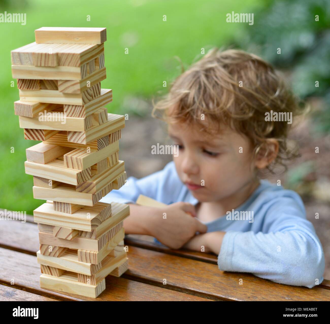 Cute child playing with building blocks and developing fine motor ... Cute child playing with building blocks and developing fine motor ...