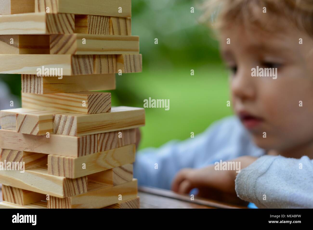 Cute child playing with building blocks and developing fine motor ...