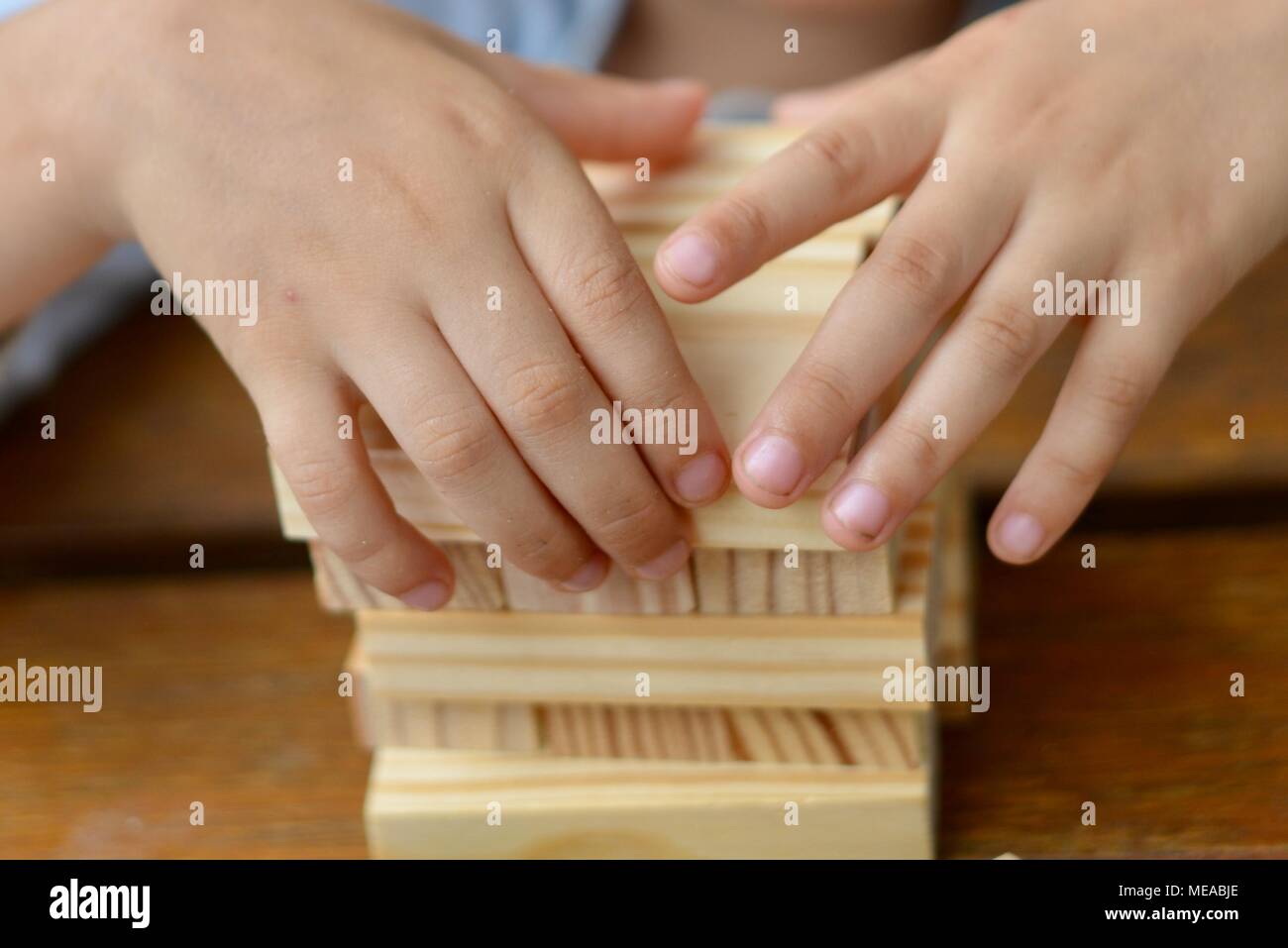 Cute child playing with building blocks and developing fine motor ...