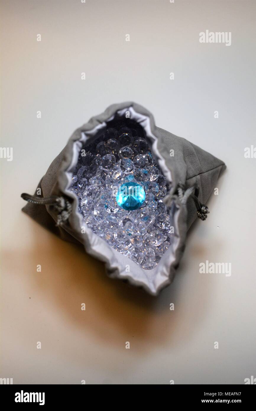 Bag and piles of Jewels Stock Photo - Alamy