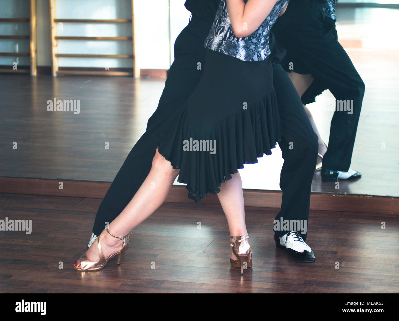 Ballroom dance couple of dancers and teachers in studio school dancing ...