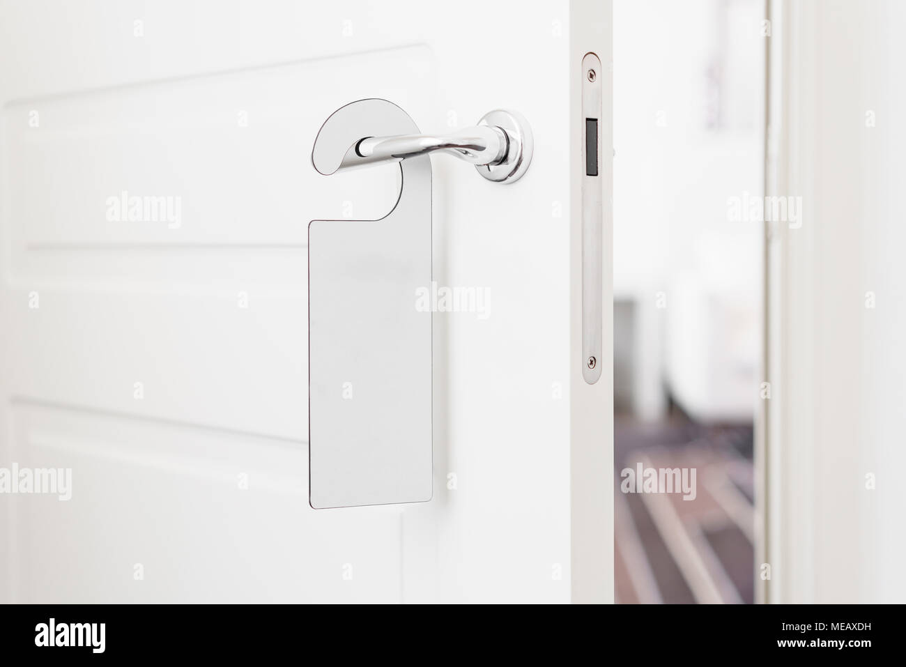 Door knob with empty label on a door handle for your text. Empty white ...